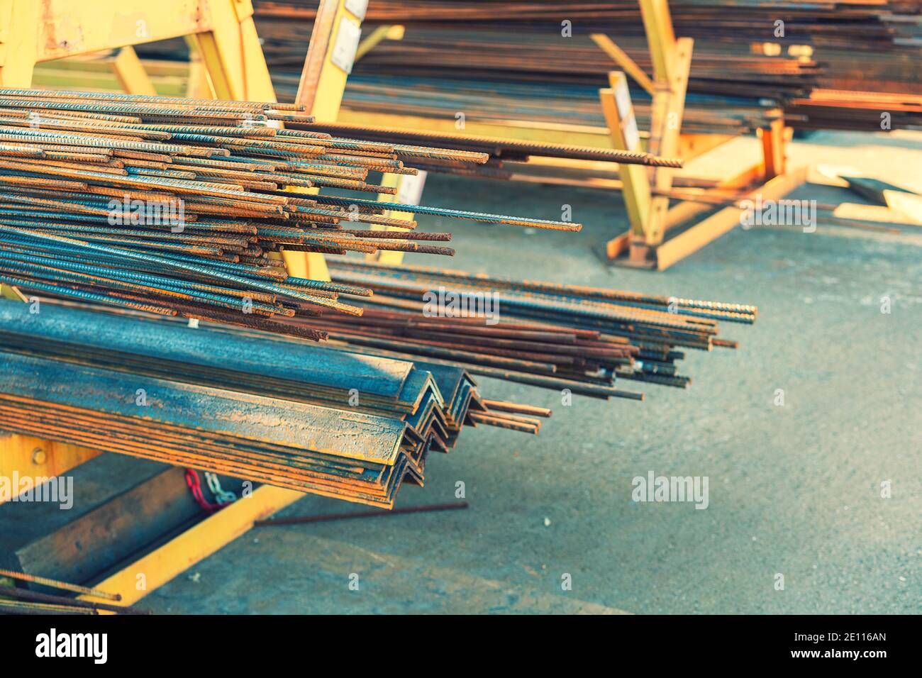 stack of steel pipe and metal beams on rack. metal pipes, profiles ...