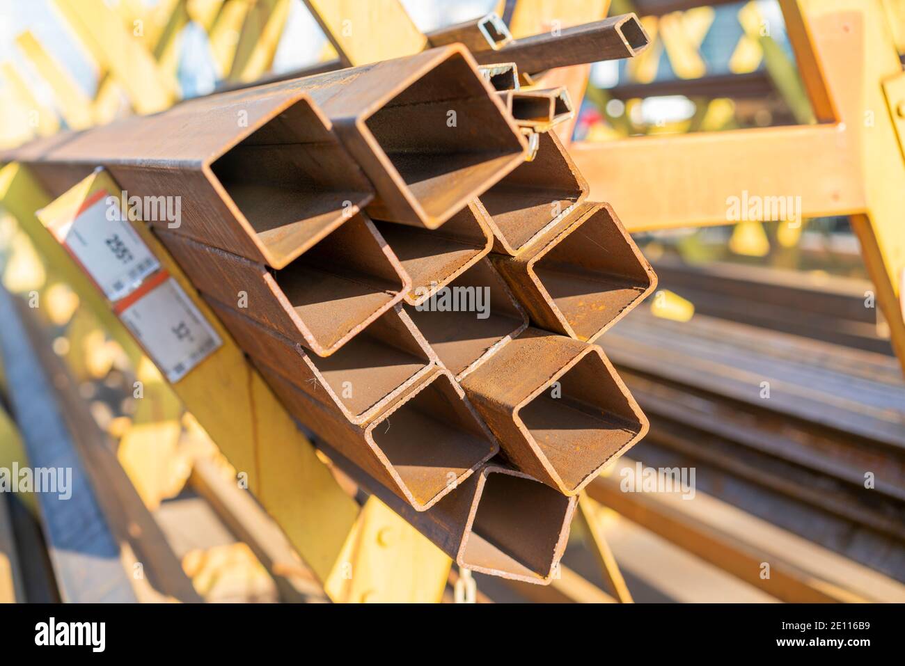 stack of steel pipe and metal beams on rack. metal pipes, profiles ...