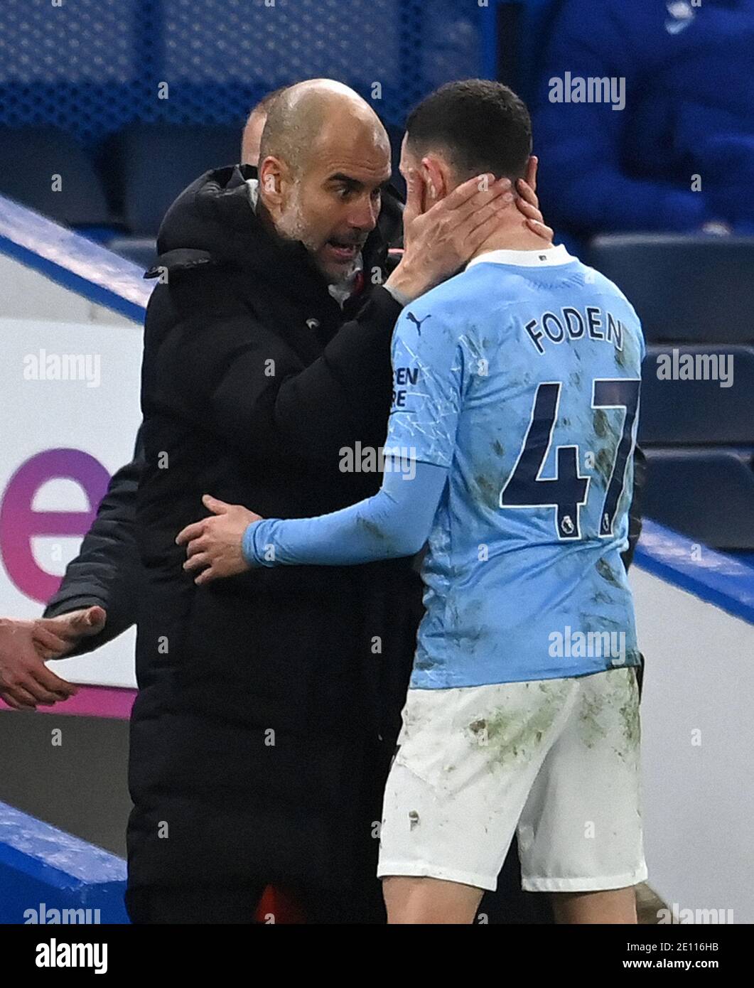 Manchester City manager Pep Guardiola greets Phil Foden as he leaves ...