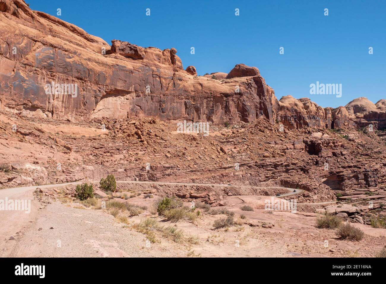 Red sandstone rocks towering over Kane Creek Road, Moab, Utah, USA ...