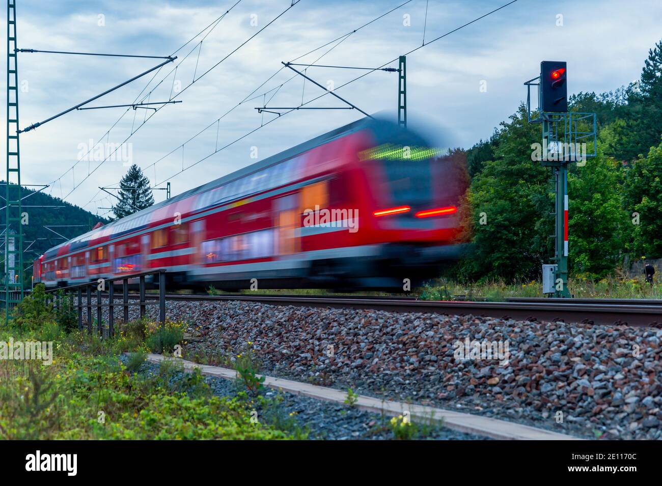 Red Regional Train With Motion Blur Stock Photo - Alamy