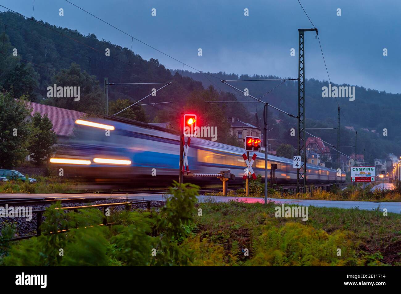 Blue Passenger Train With Motion Blur Stock Photo - Alamy