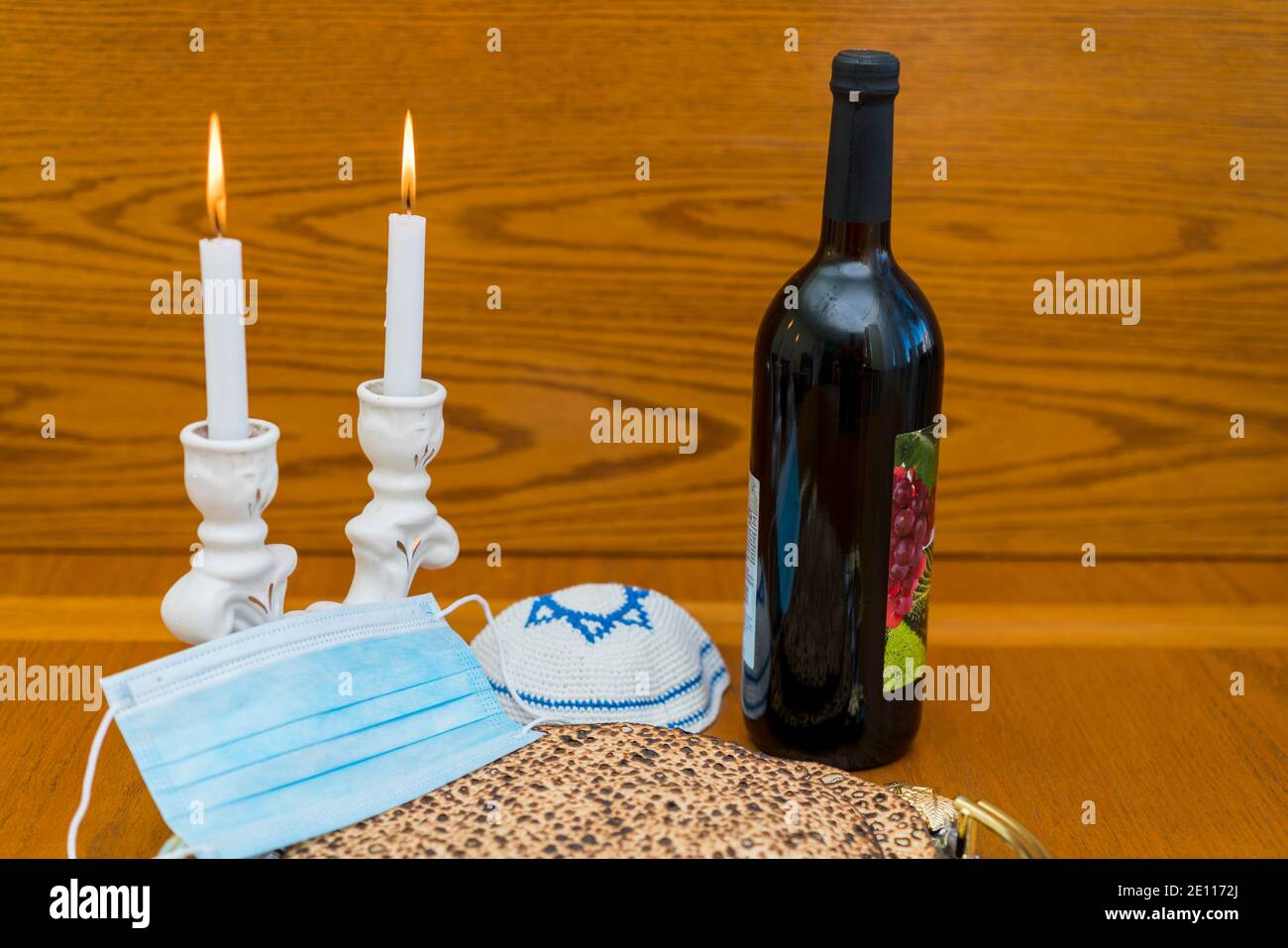 Corona Passover. Dust mask, bottle of wine and matzah - a traditional ...