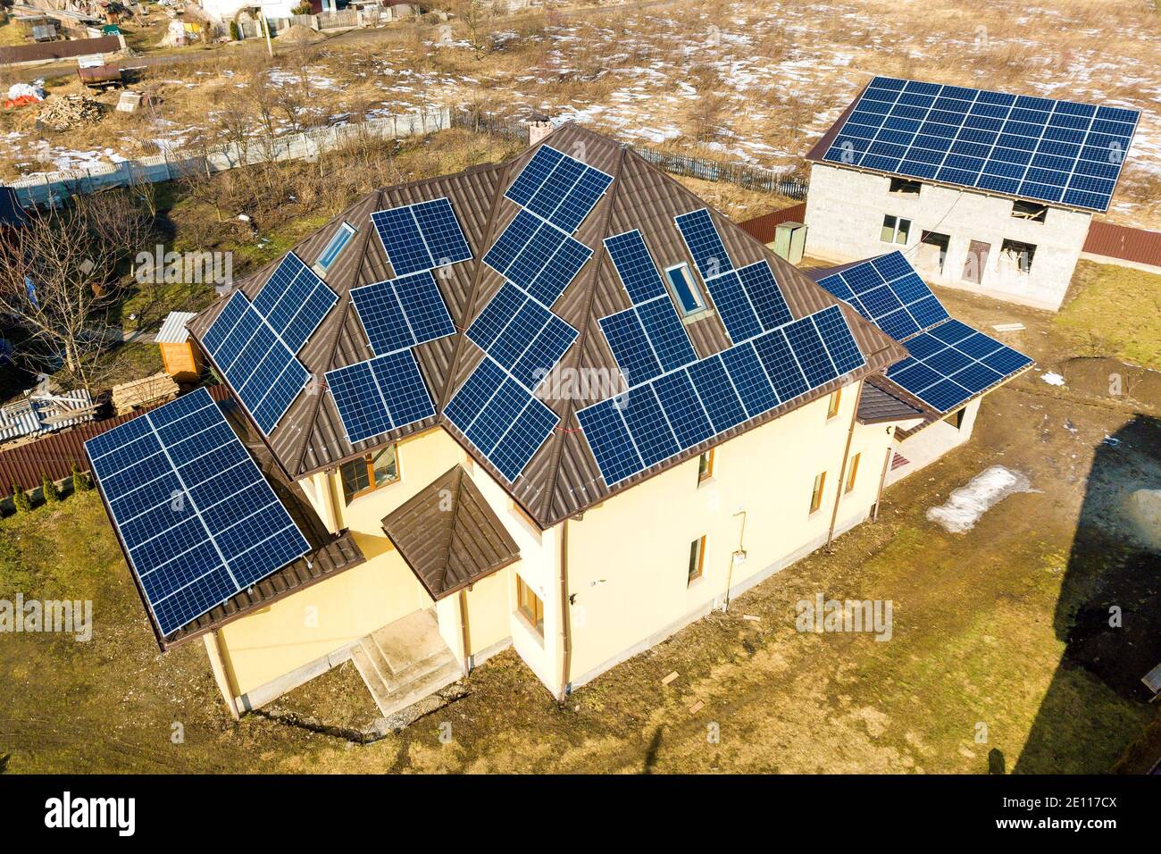 Aerial top view of new modern residential house cottage with blue shiny ...