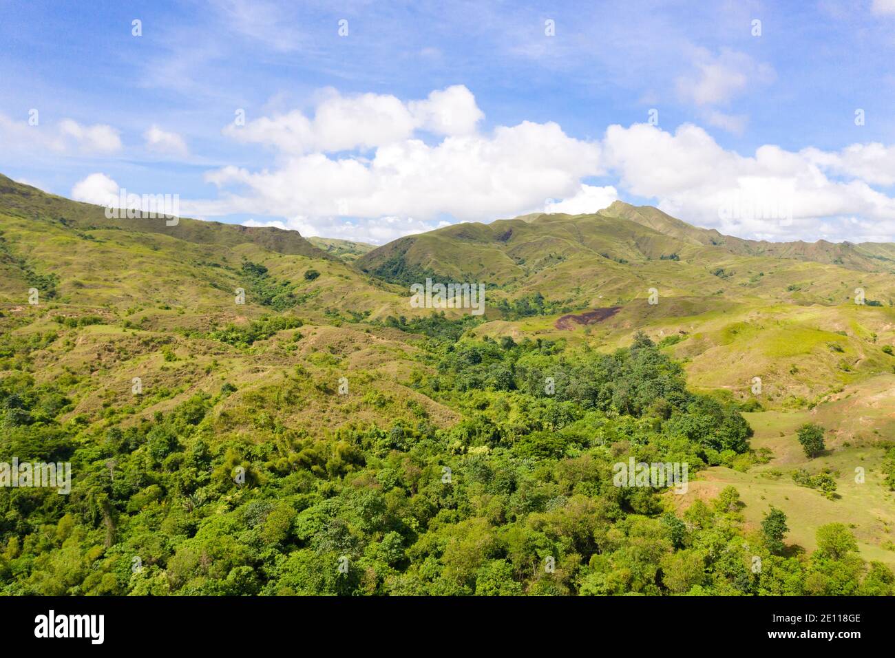 Green hills and blue sky with clouds. Beautiful landscape on the island ...