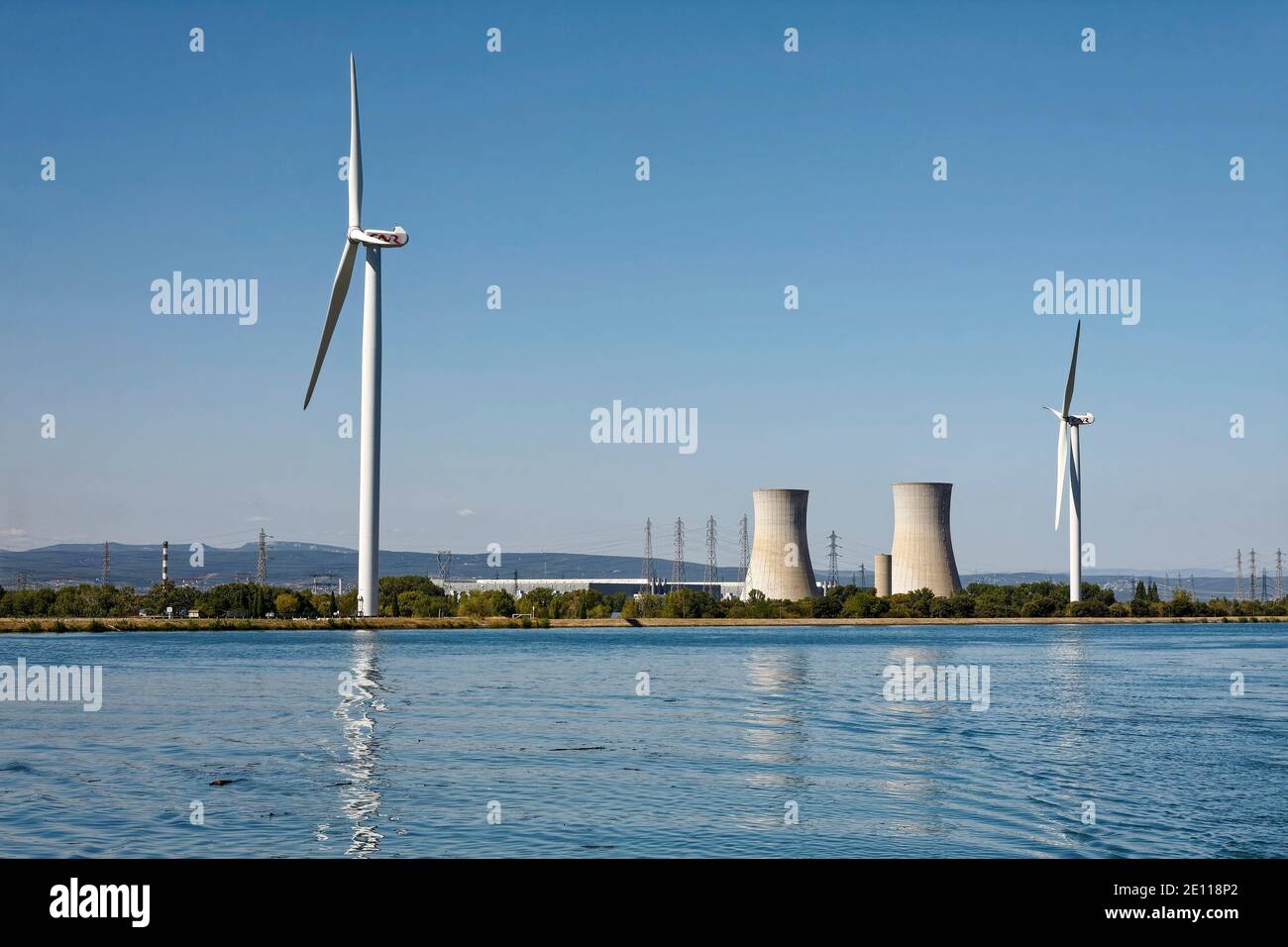 Industrial scene, wind turbines, cooling towers, transmission lines ...