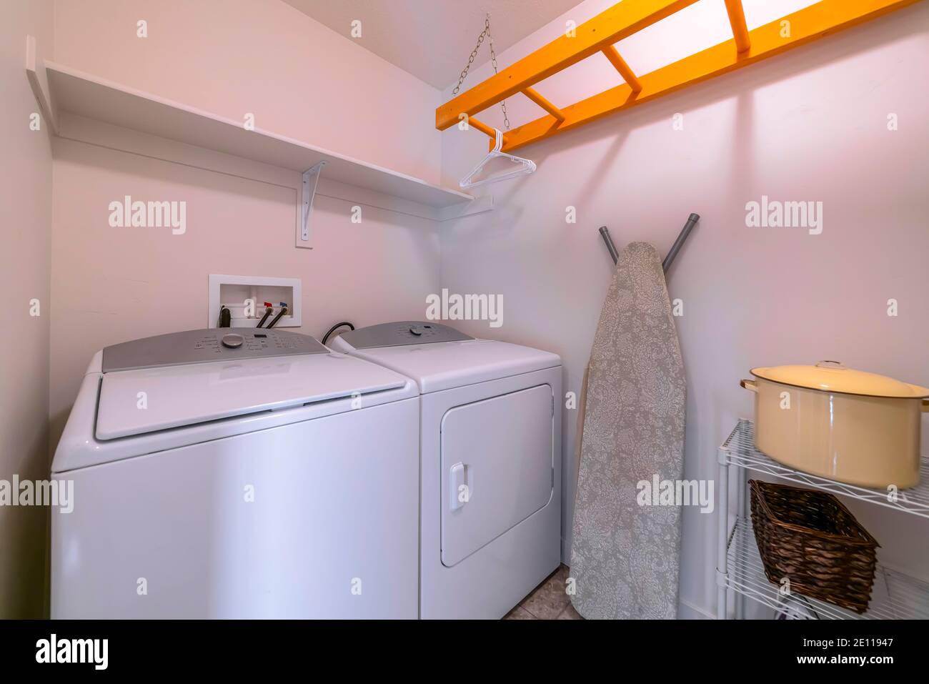 Interior of the laundry room of home with washing machine and dryer ...