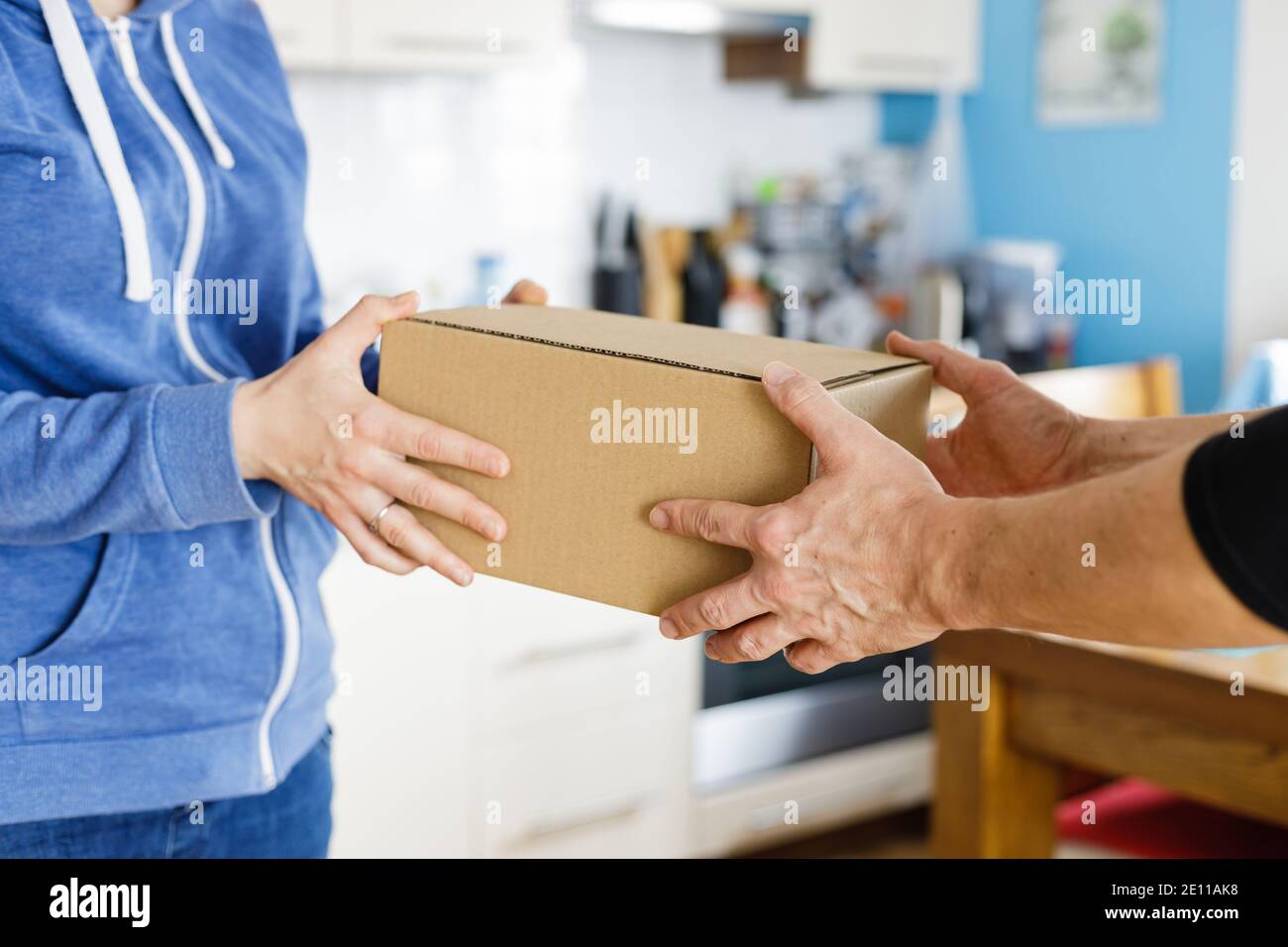 Parcel delivery at home Stock Photo - Alamy