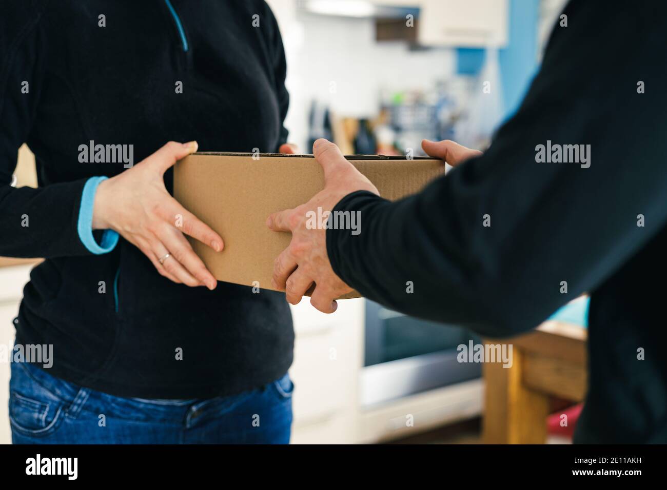 Parcel delivery at home Stock Photo - Alamy