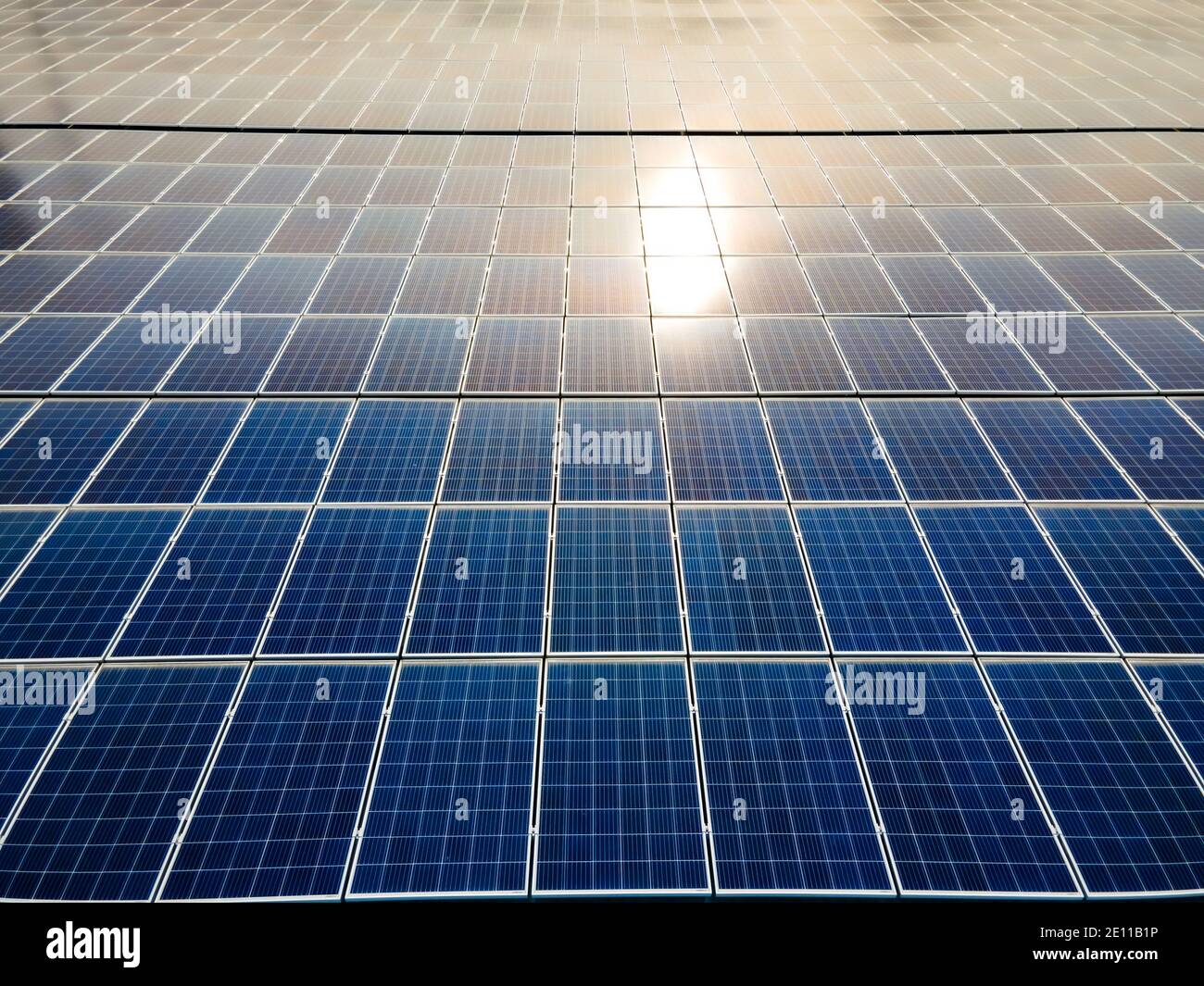 Aerial view of surface of blue photovoltaic solar panels mounted on ...