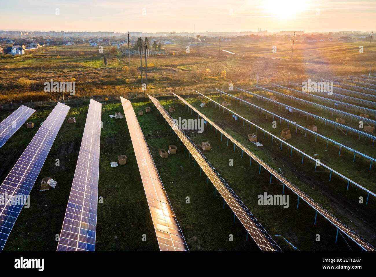 Aerial view of solar power plant under construction on green field ...