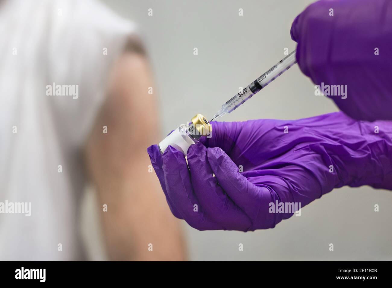 Injection of a vaccine. Concept to prevent diseases. Doctor with a ...