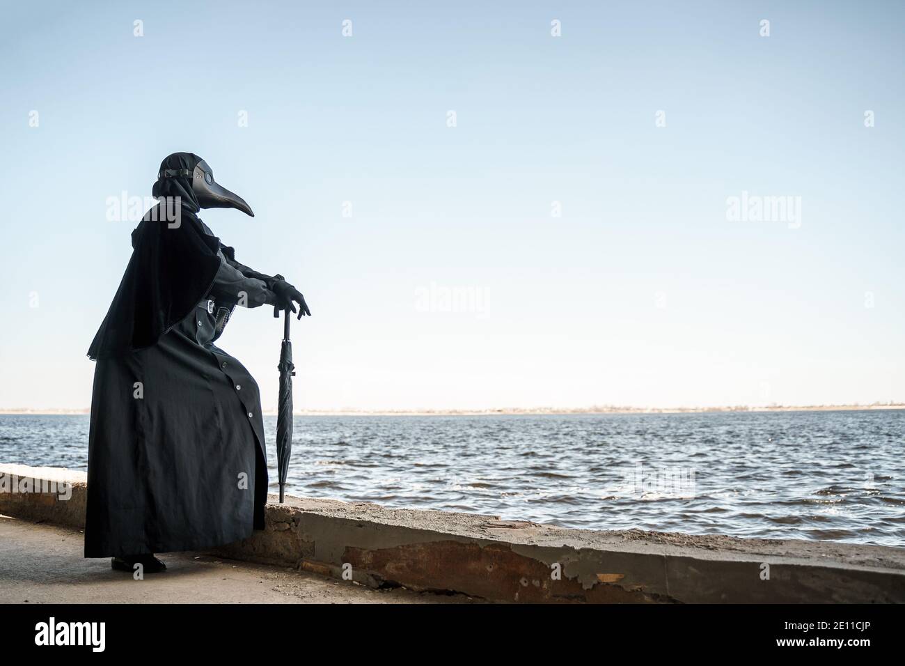 plague doctor in an empty city on an empty marina Stock Photo - Alamy