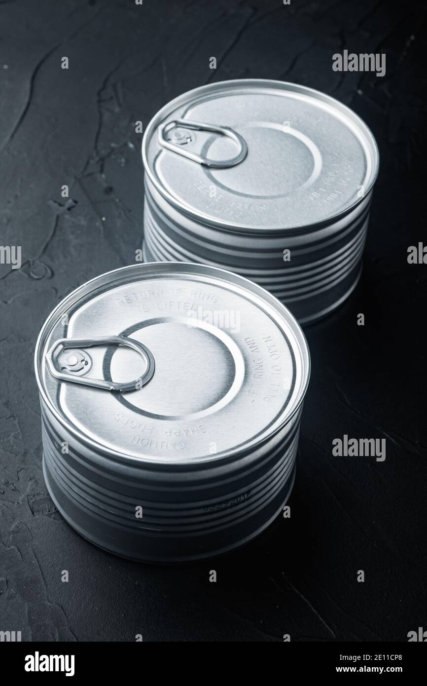 Canned sauce tin can, on black background Stock Photo - Alamy