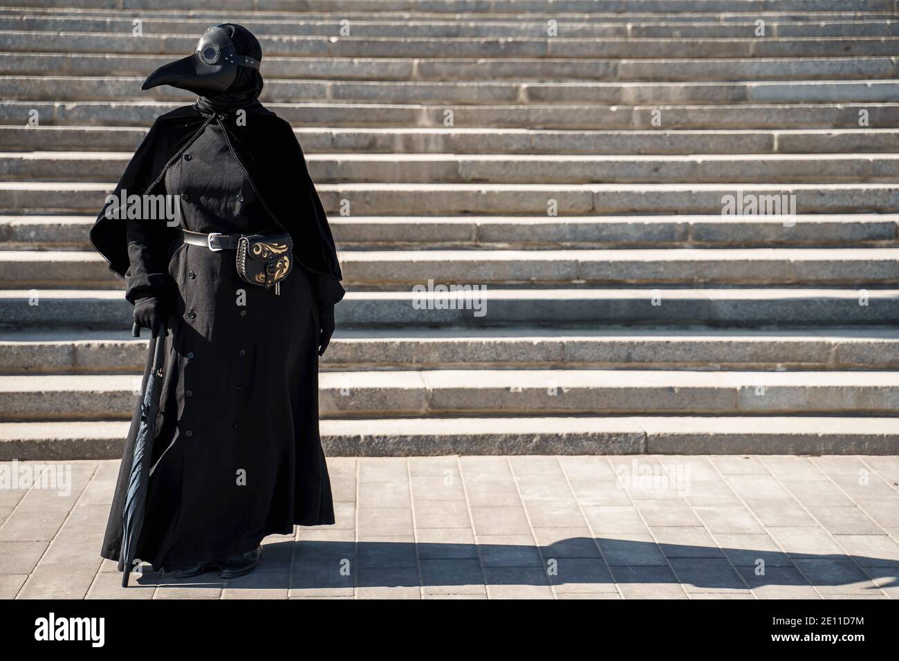 plague doctor in front of the stairs to the top Stock Photo - Alamy