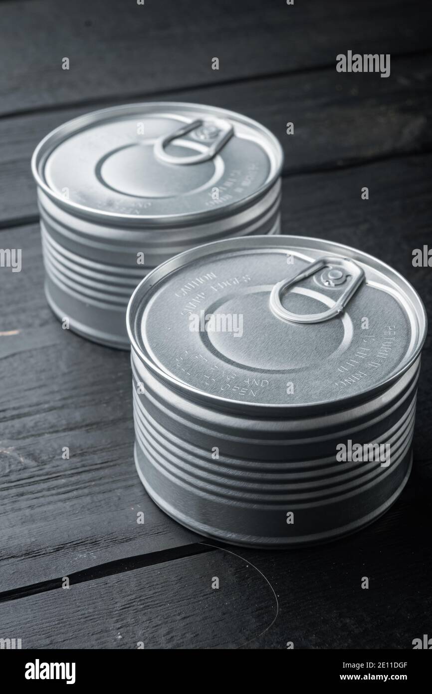 Canned dip tin can, on black wooden background Stock Photo - Alamy
