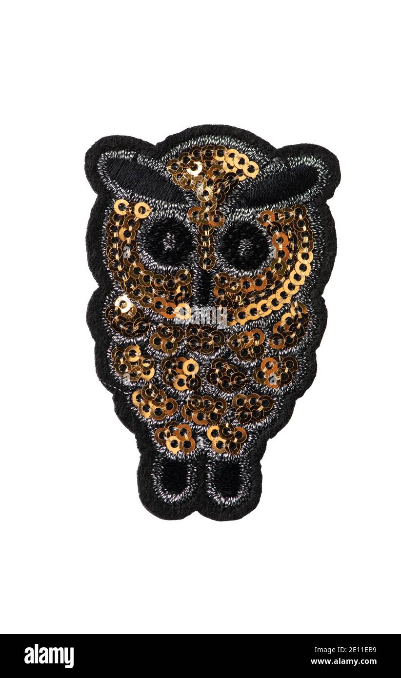 Tiny owl embroidered patch with golden sequins isolated on white ...