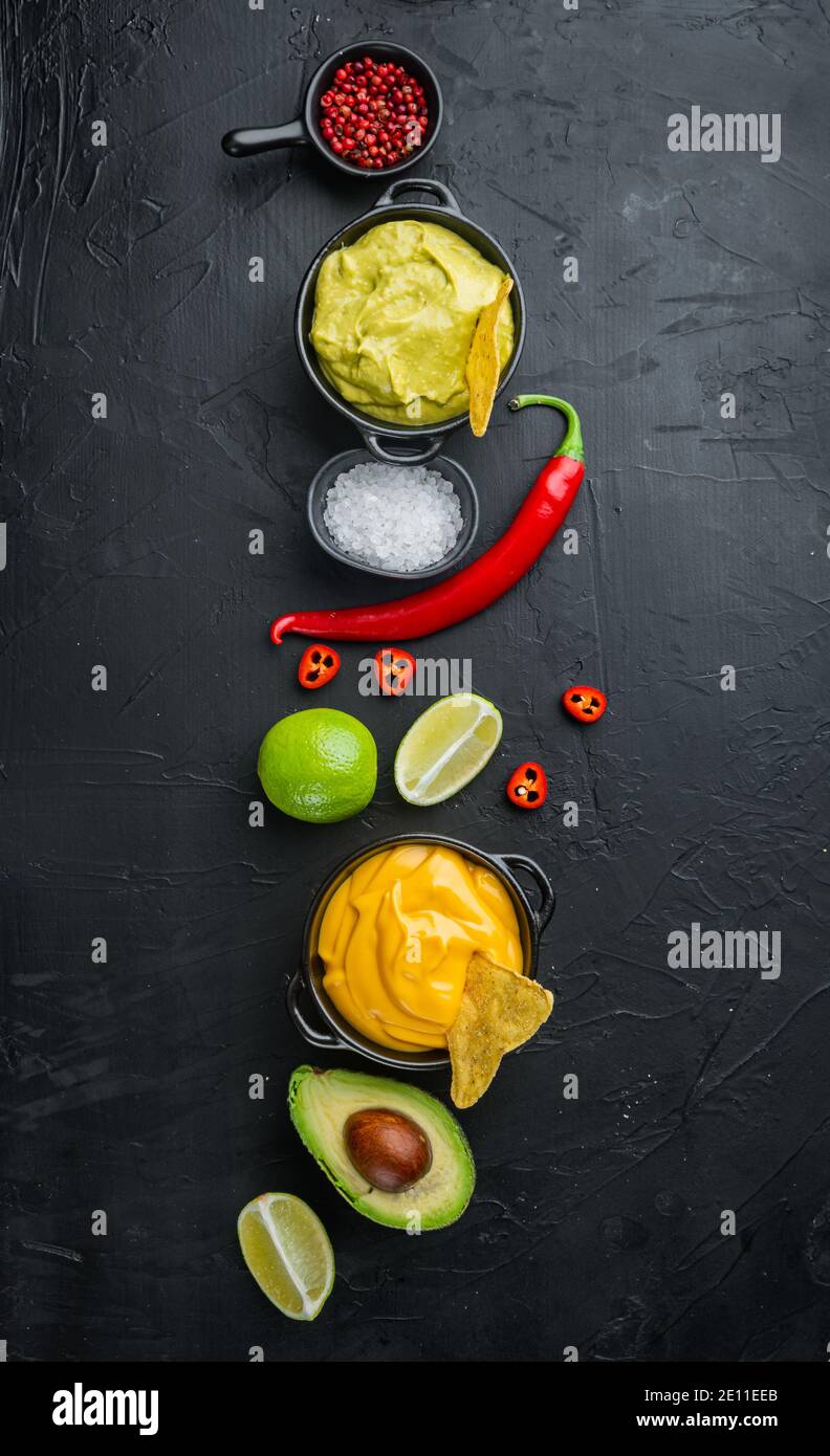 Green guacamole and yellow cheese dip sauce for traditional, Mexican ...