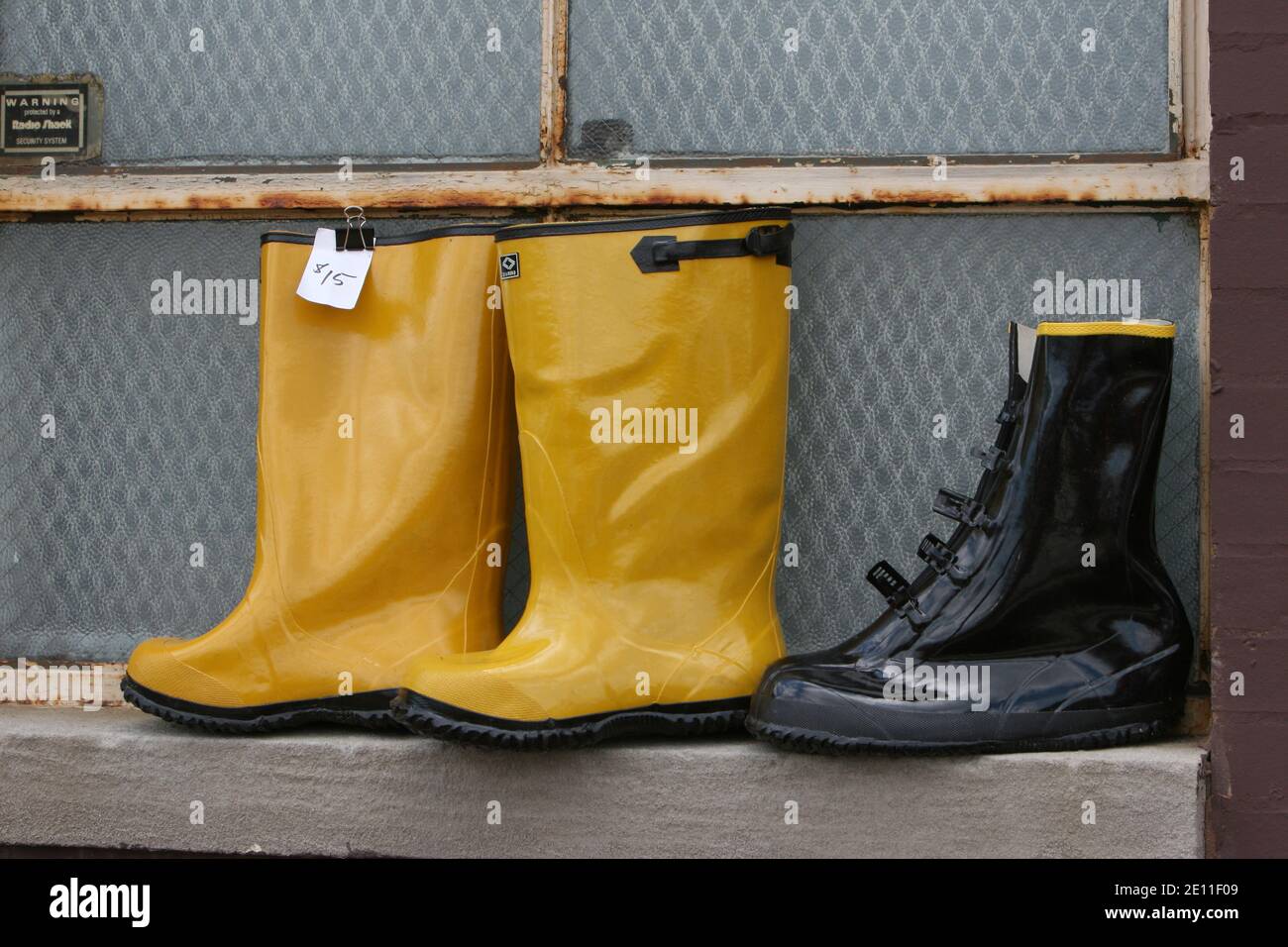 rubber boots in window, Chicago Stock Photo - Alamy