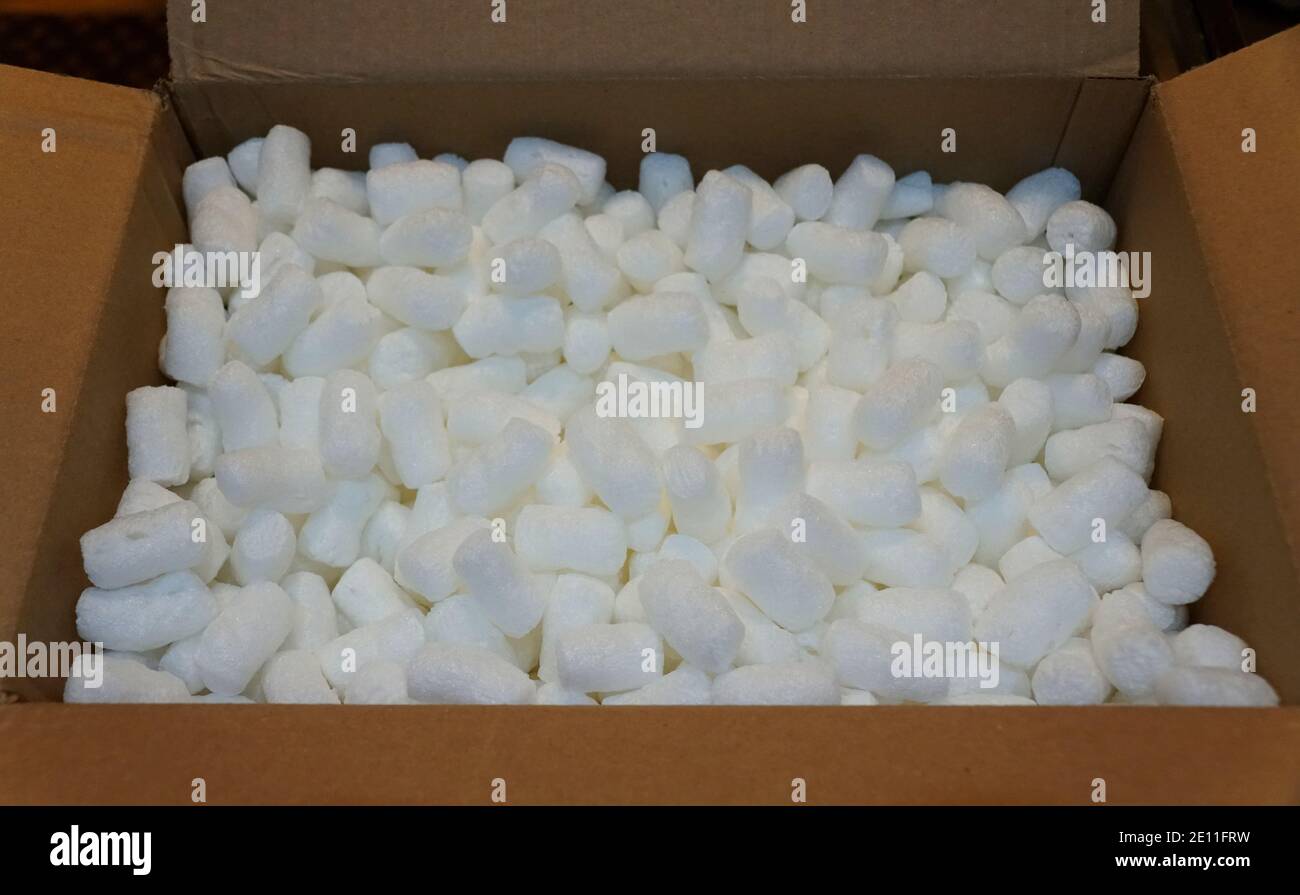 White packing peanuts inside a brown box to secure shipment Stock Photo ...