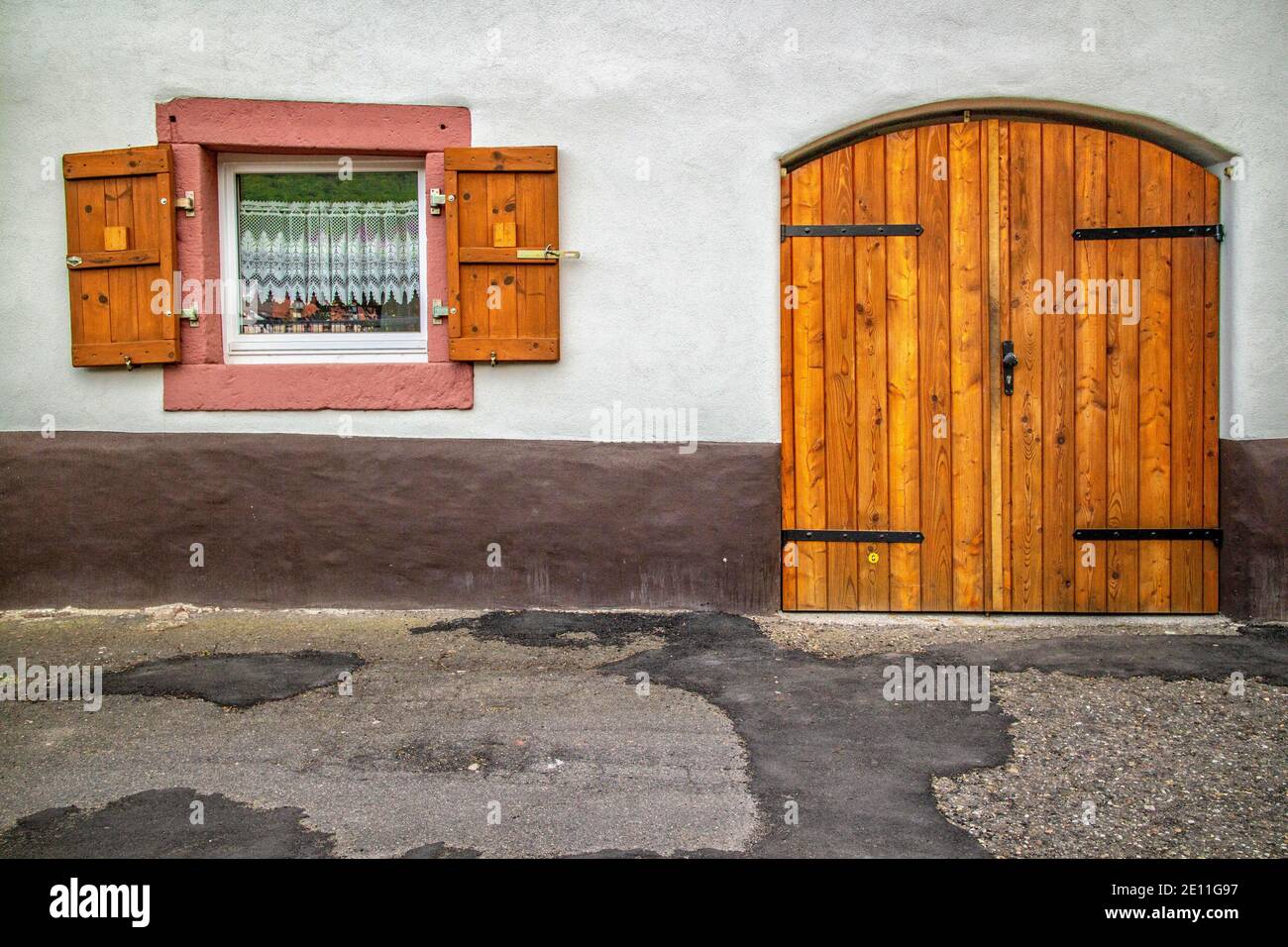 Windows and entrance gate of an old house in a small german city Stock ...