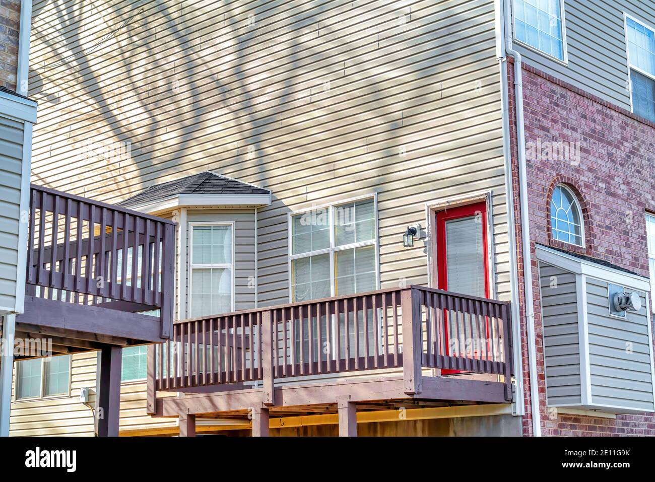 Balcony of a residential building with bay window and white sunlit ...