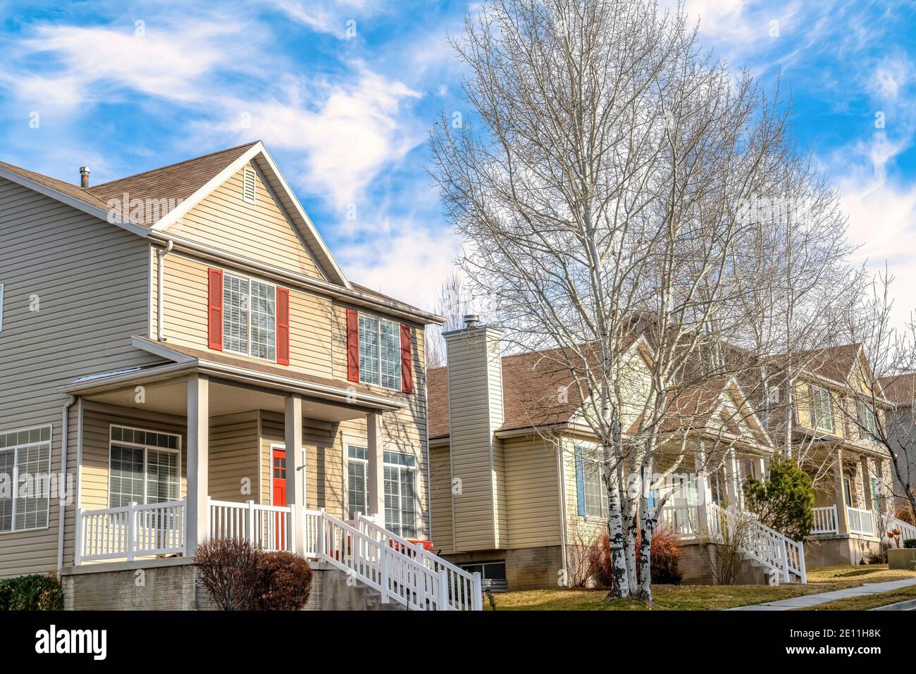Neighborhood scenery with homes featuring porches overlooking the yards ...