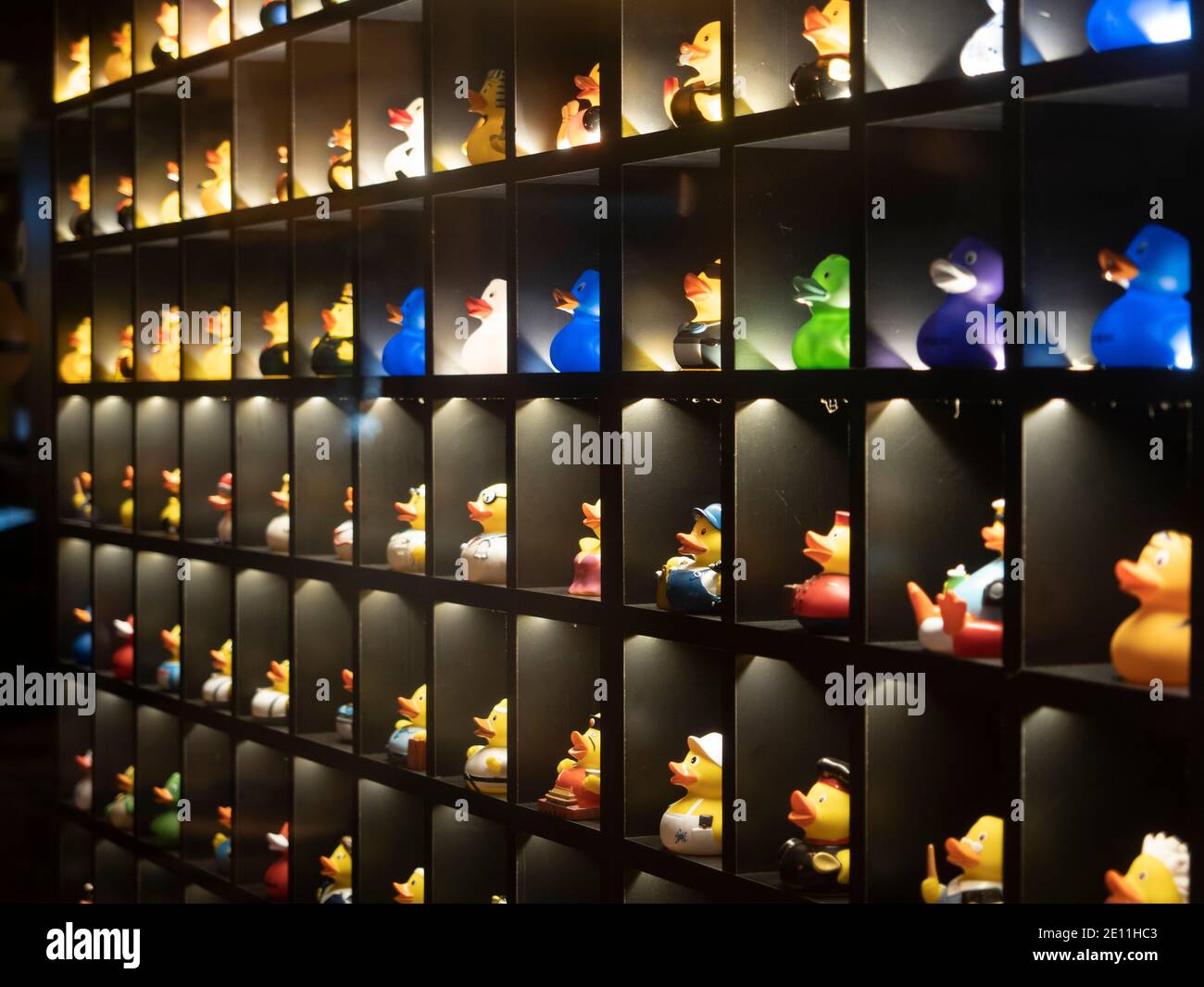 Colorful plastic ducks collection on honeycomb of shelves Stock Photo ...