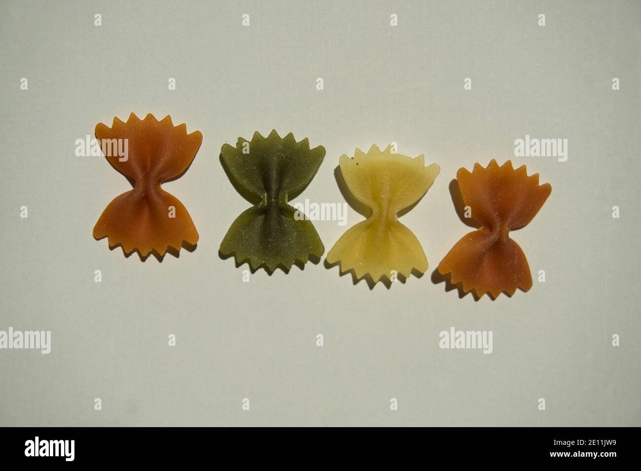 Close-up farfalle. Traditional shape of dry uncooked whole wheat ...