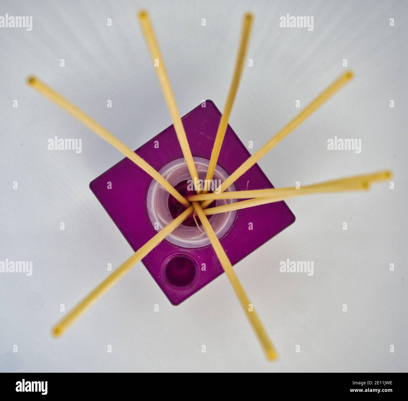 Aromatic reed air freshener on pink background hard shadow ...
