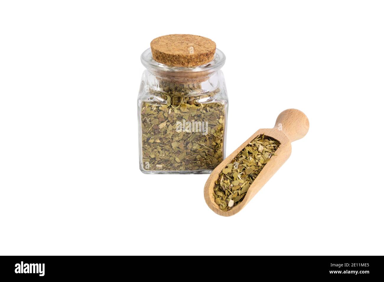 yerba mate in wooden scoop and glass jar on isolated on white ...