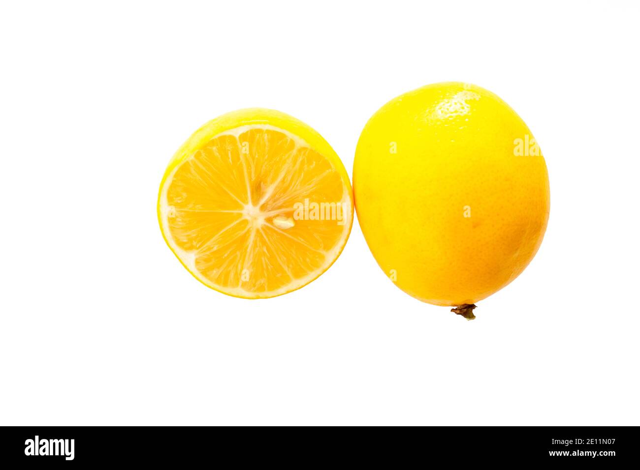 Half a lemon cut in the middle on white background Stock Photo - Alamy