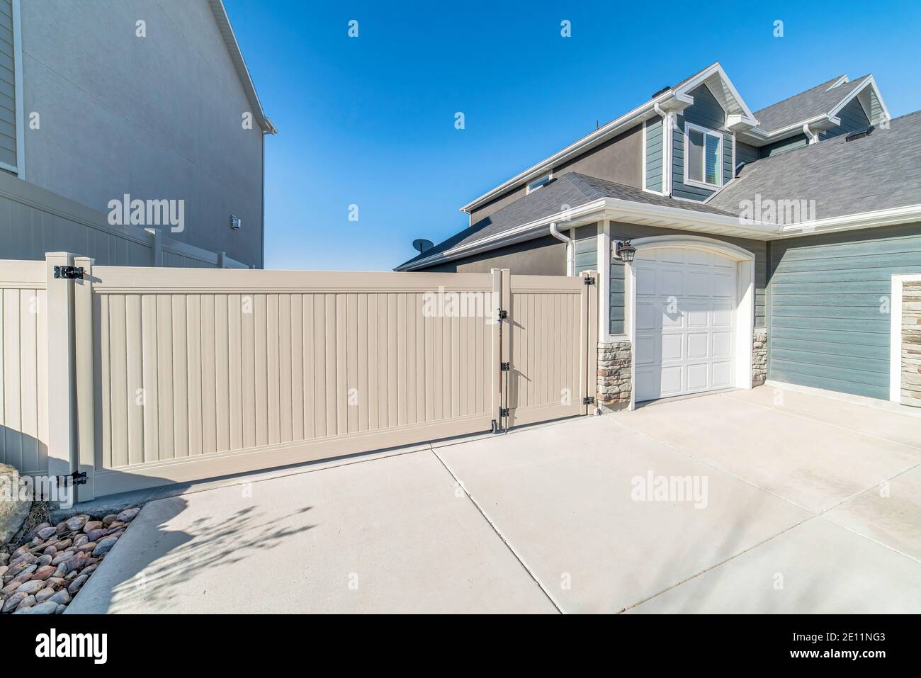 Wide gate that leads to the yard beside the detached two car garage of ...