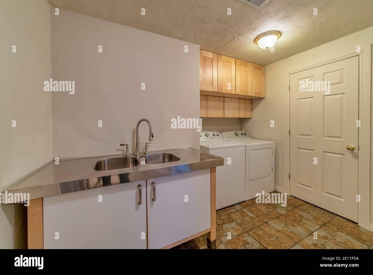 Double basin sink and curved faucet with cabinet inside functional ...