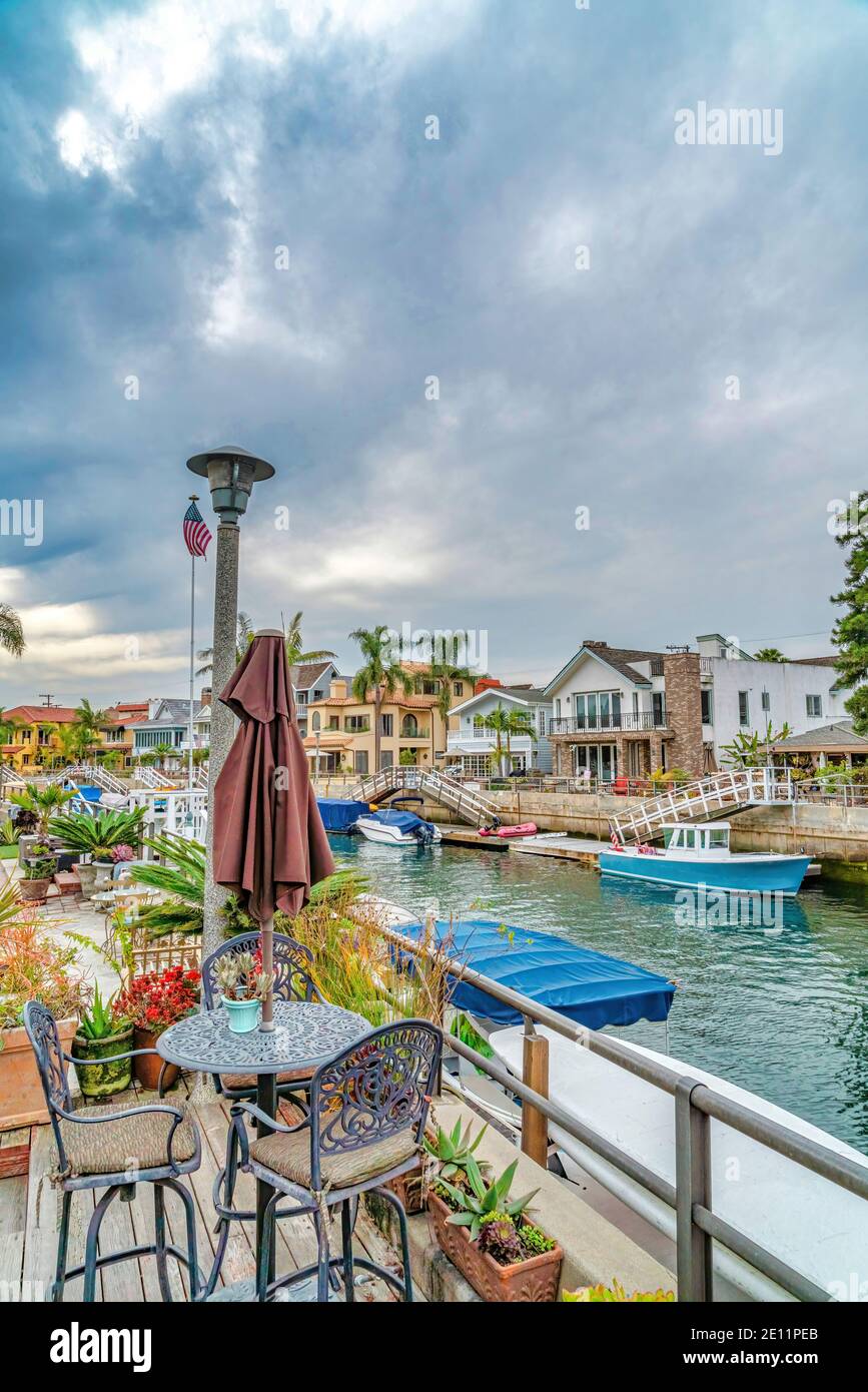 Outdoor table and chairs with view of scenic canal in Long Beach ...