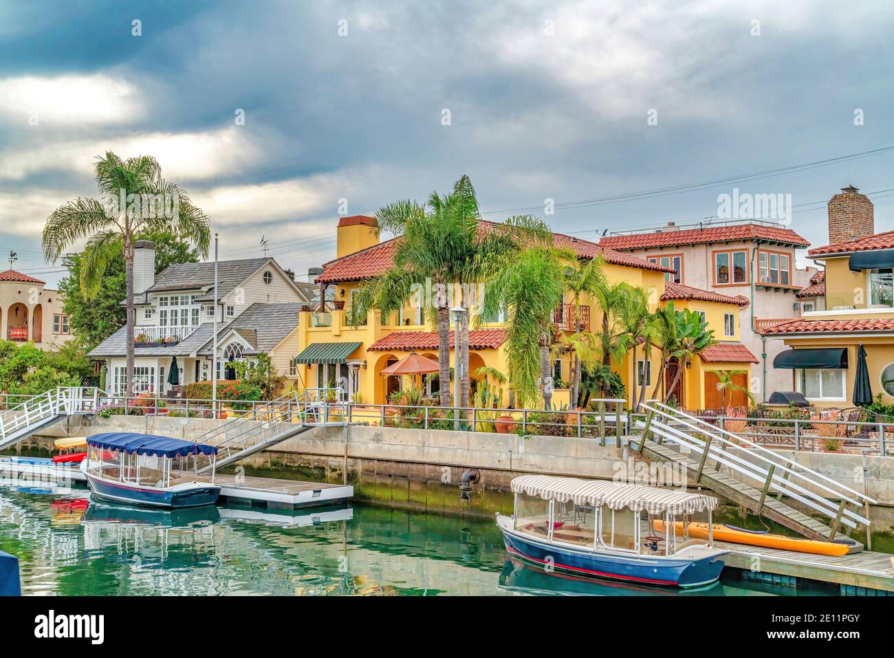 Canal with duffy boats along elegant waterfront homes in Long Beach ...