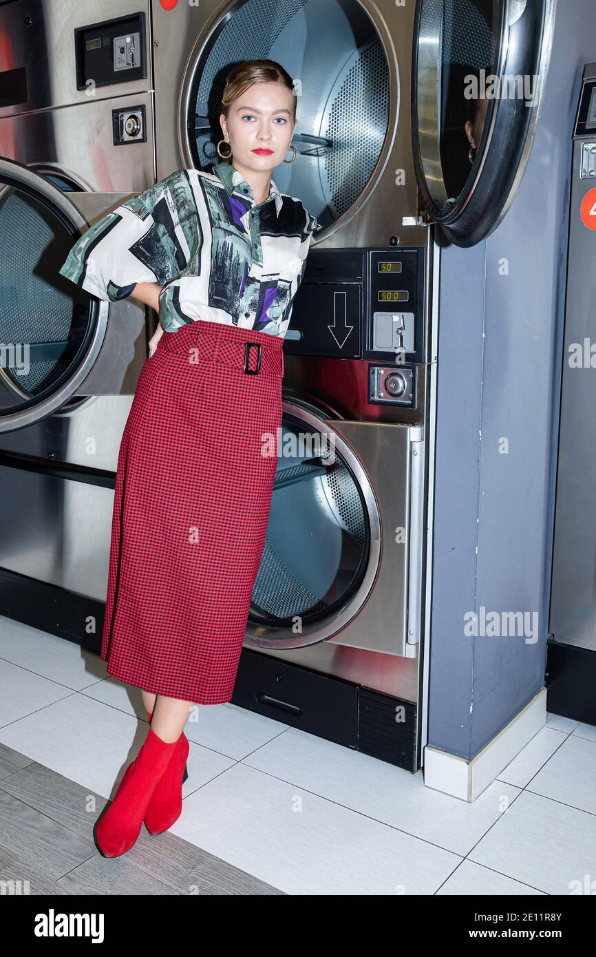 Girl model in red skirt with washing machine Stock Photo - Alamy