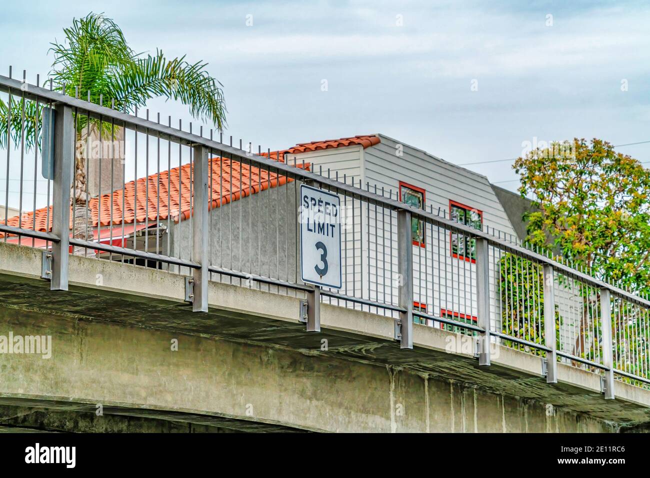 Speed Limit sign on the metal guardrail of a bridge in Long Beach ...