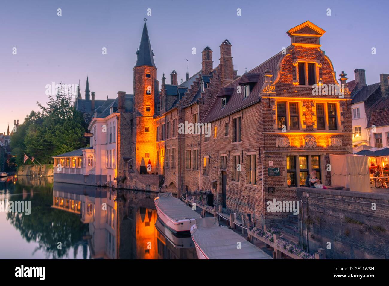 BRUGES, BELGIUM, 21 JULY 2020: Sunset over the canal in the historic ...