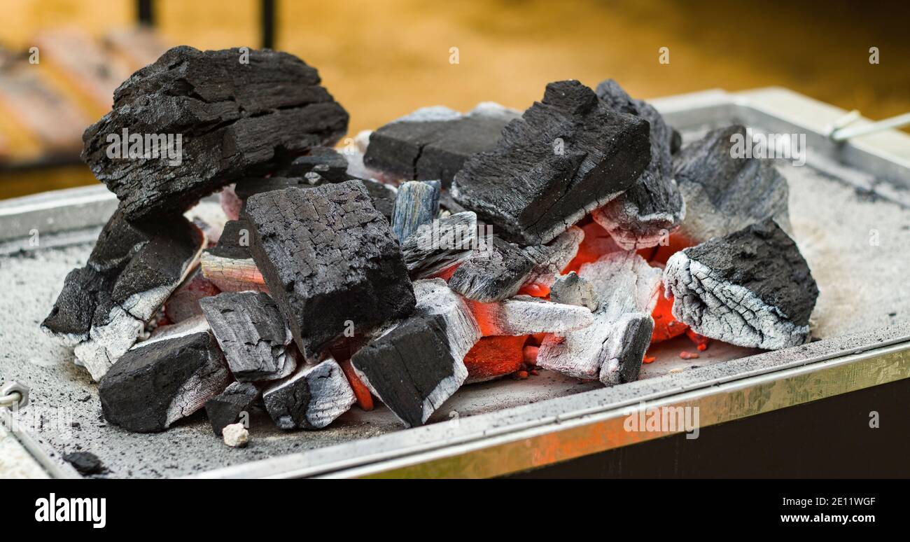 White coal charcoal with flames Stock Photo - Alamy