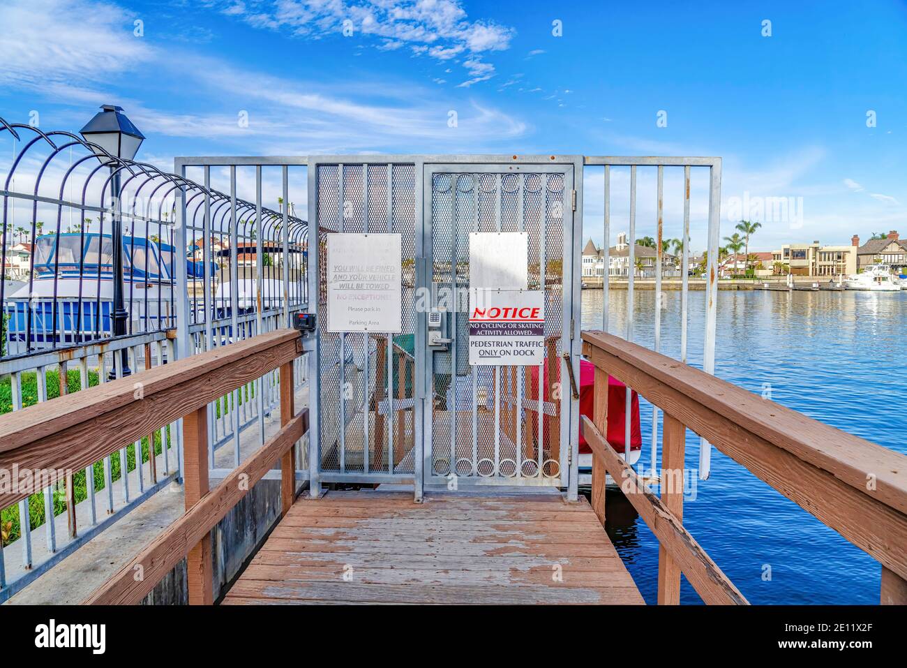 Warning signs and notices at the gate of a dock in Huntington Beach ...