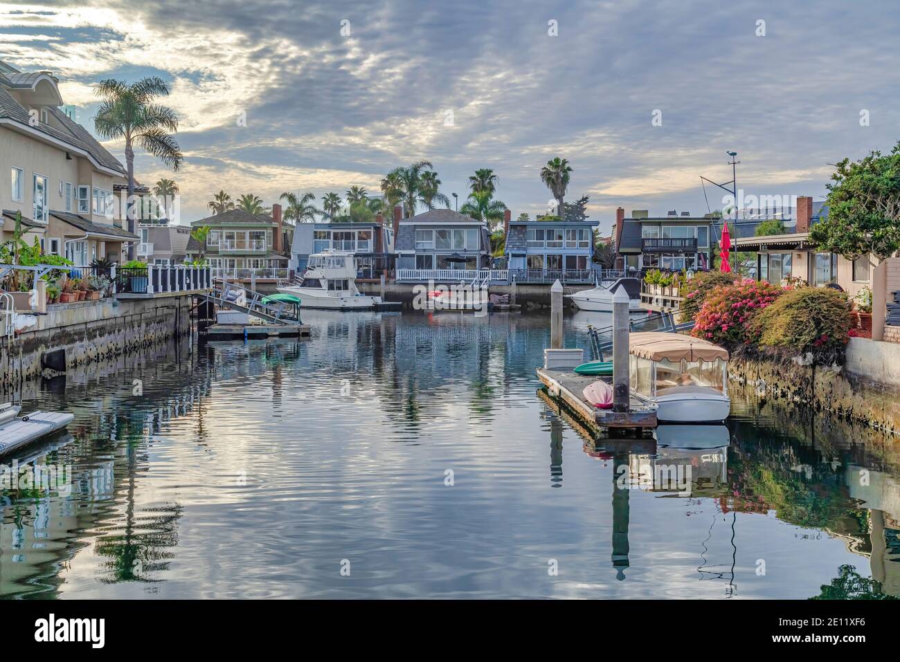 Sunset view in Huntington Beach with boats on private docks of ...
