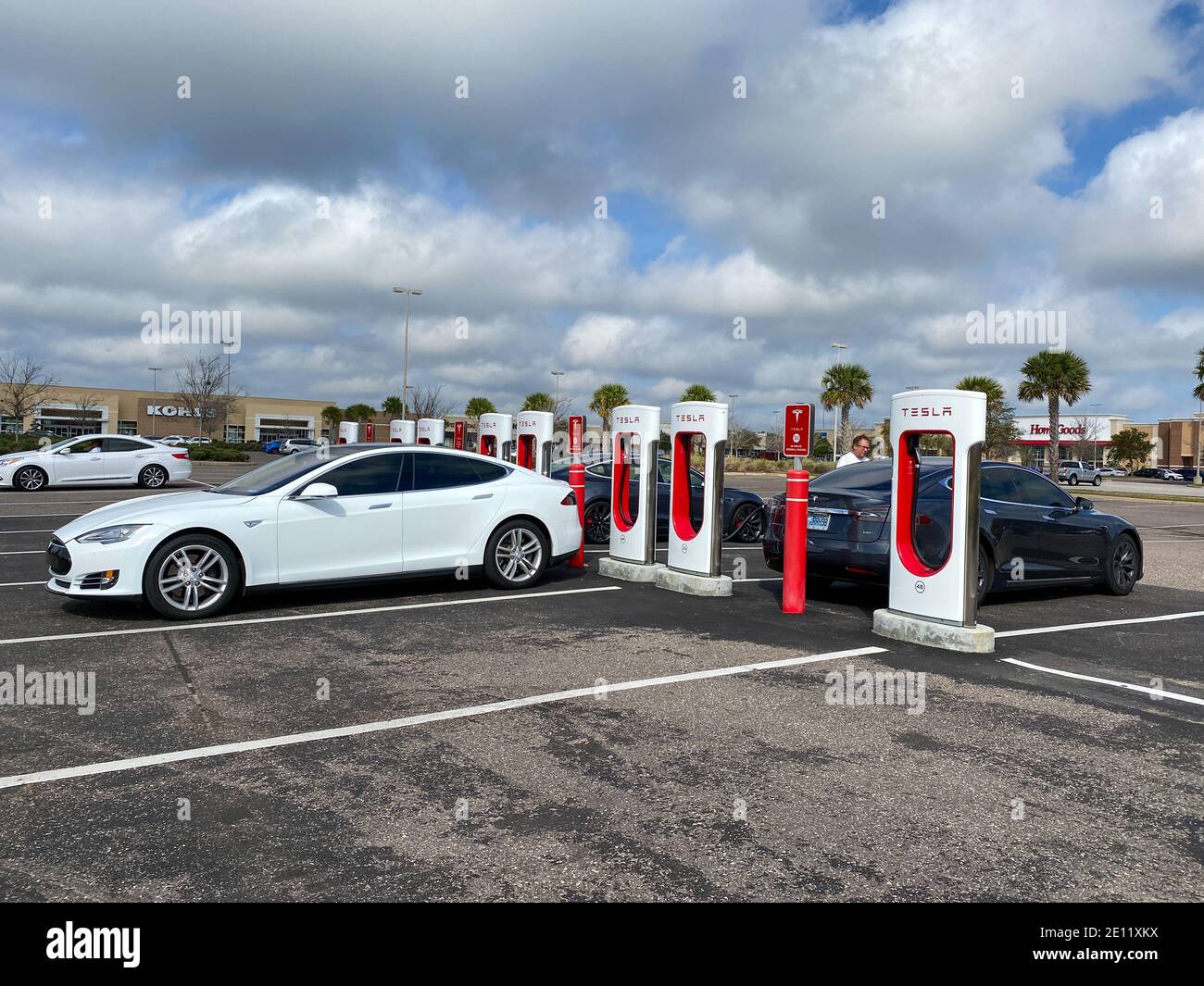 Melbourne, FL USA - March 4 2020: Cars charging at a Tesla Supercharger ...