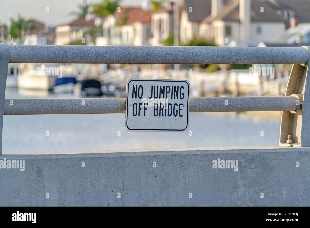 No Jumping sign on the metal railing of bridge over water in Huntington ...