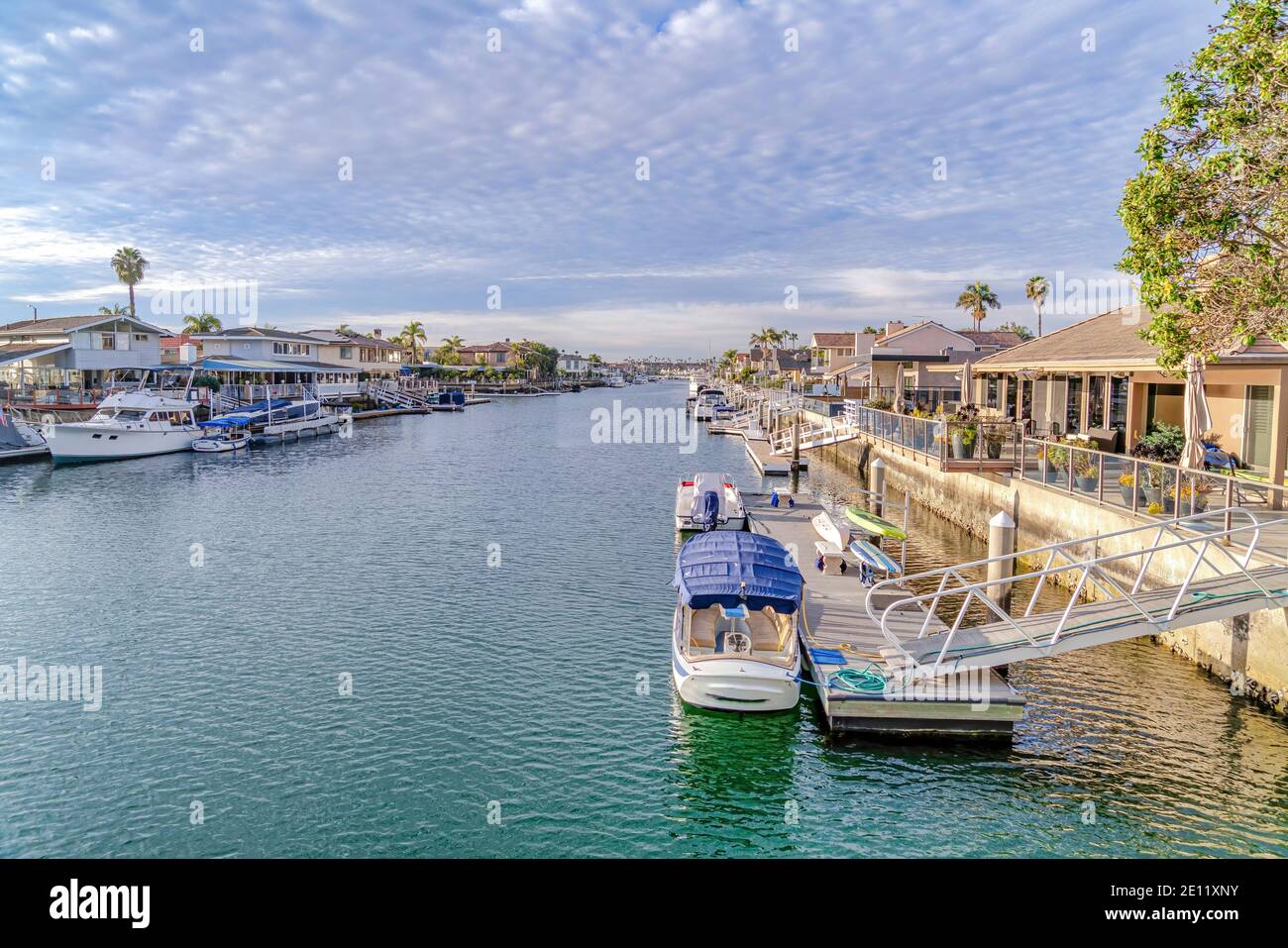 Waterfront homes with boats and private docks overlooking the sea at ...