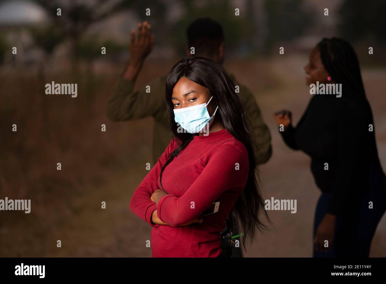 a young african lady folds her hands outdoor Stock Photo - Alamy