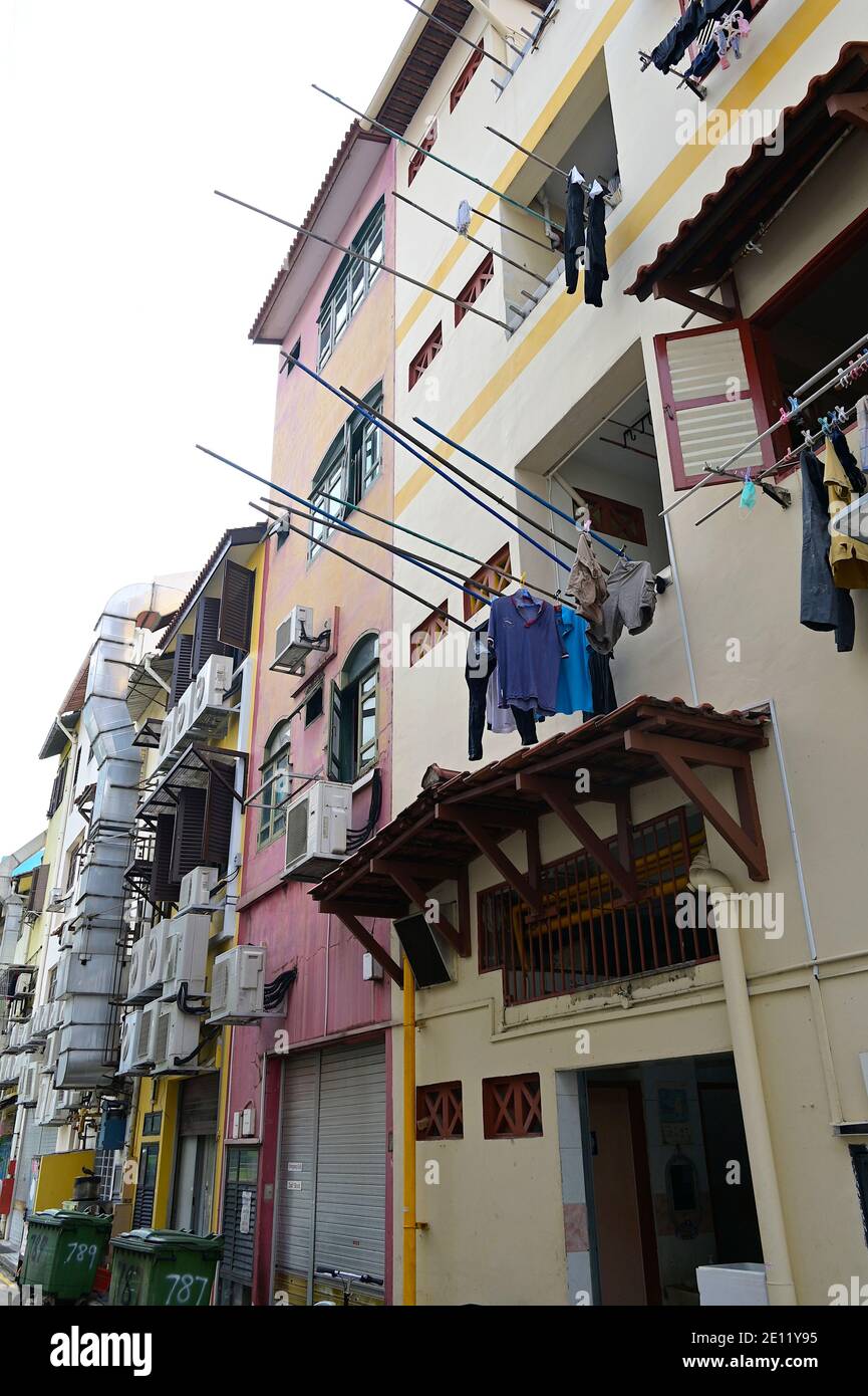 Back alley of a row of shophouses in Southeast Asia, with multiple air ...