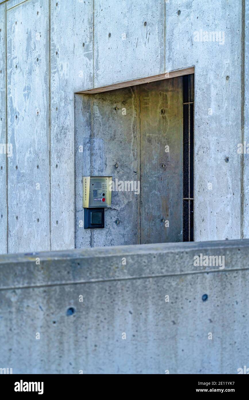 Security box and iron gate at the entryway of a school building in San ...