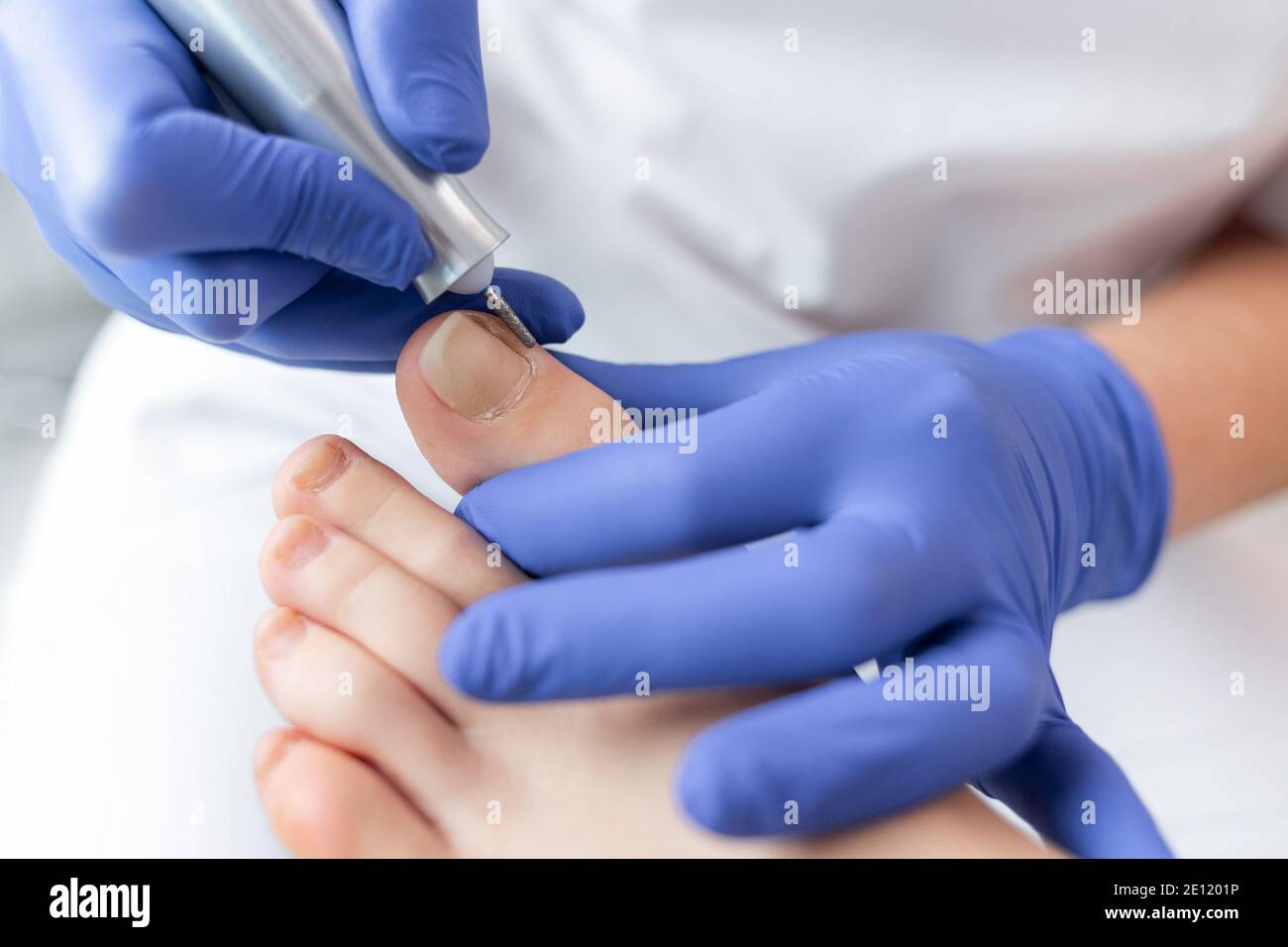 Peeling feet with special electric device.Professional hardware ...