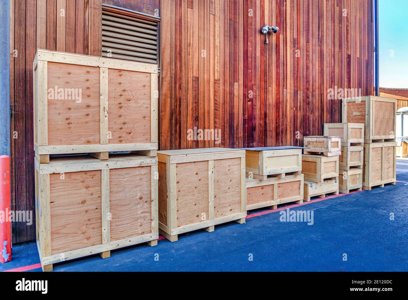 Crate container boxes against exterior wall and ventilator window of ...